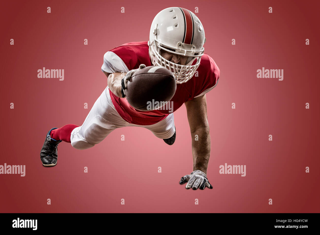 Football Player with a red uniform scoring on a red background Stock ...