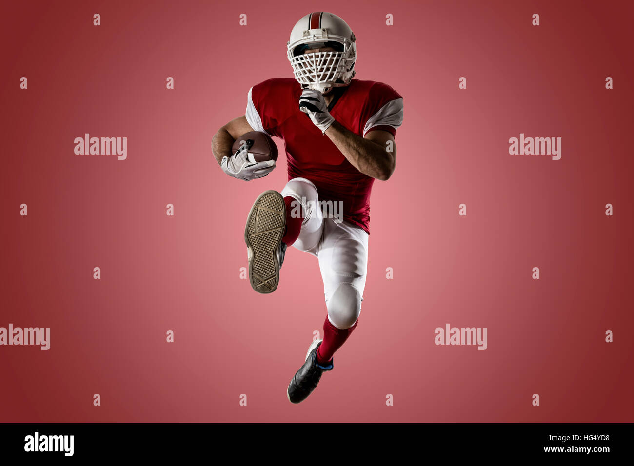 Football Player with a red uniform Running on a red background Stock ...