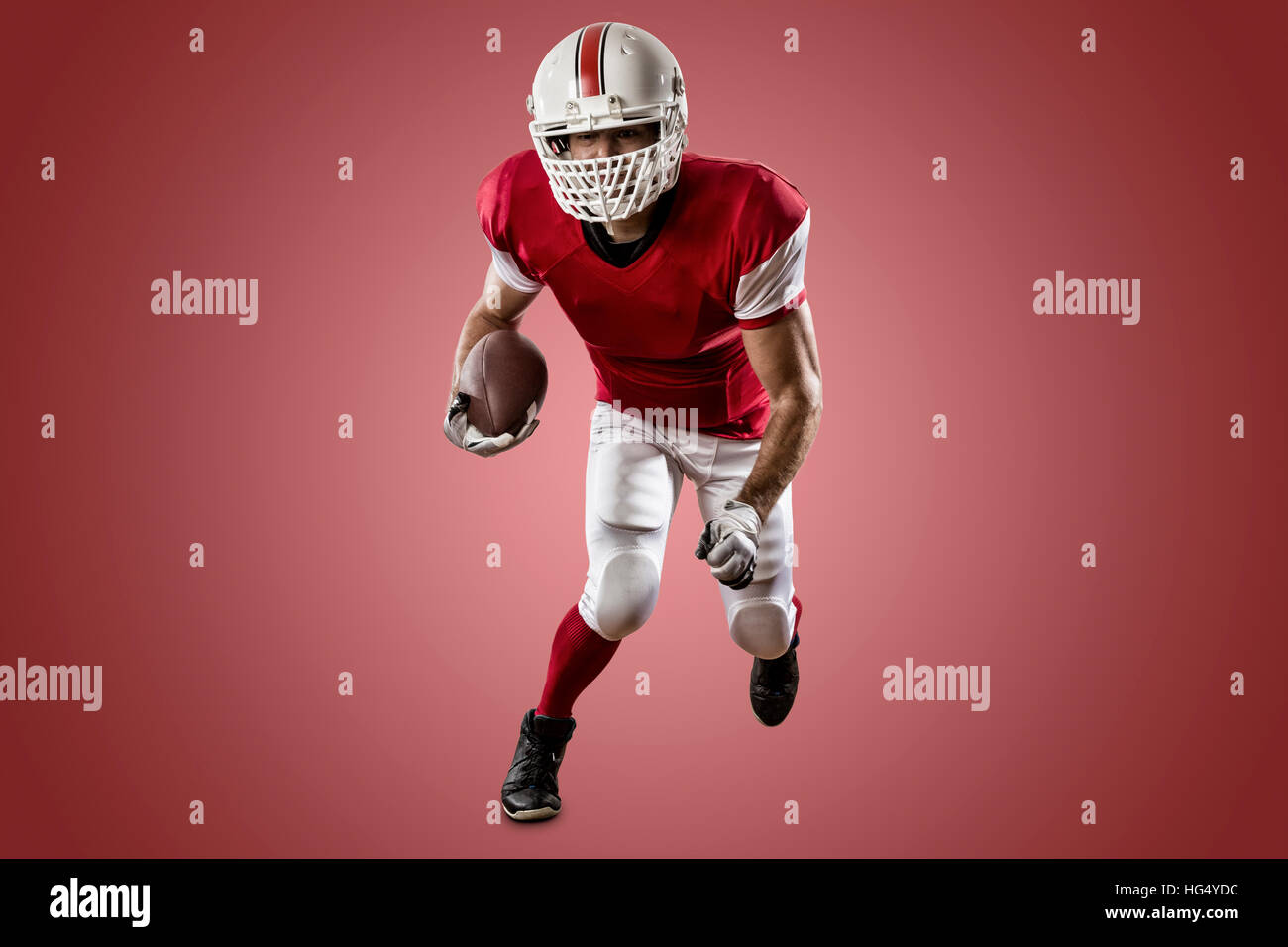 Football Player with a red uniform Running on a red background Stock ...