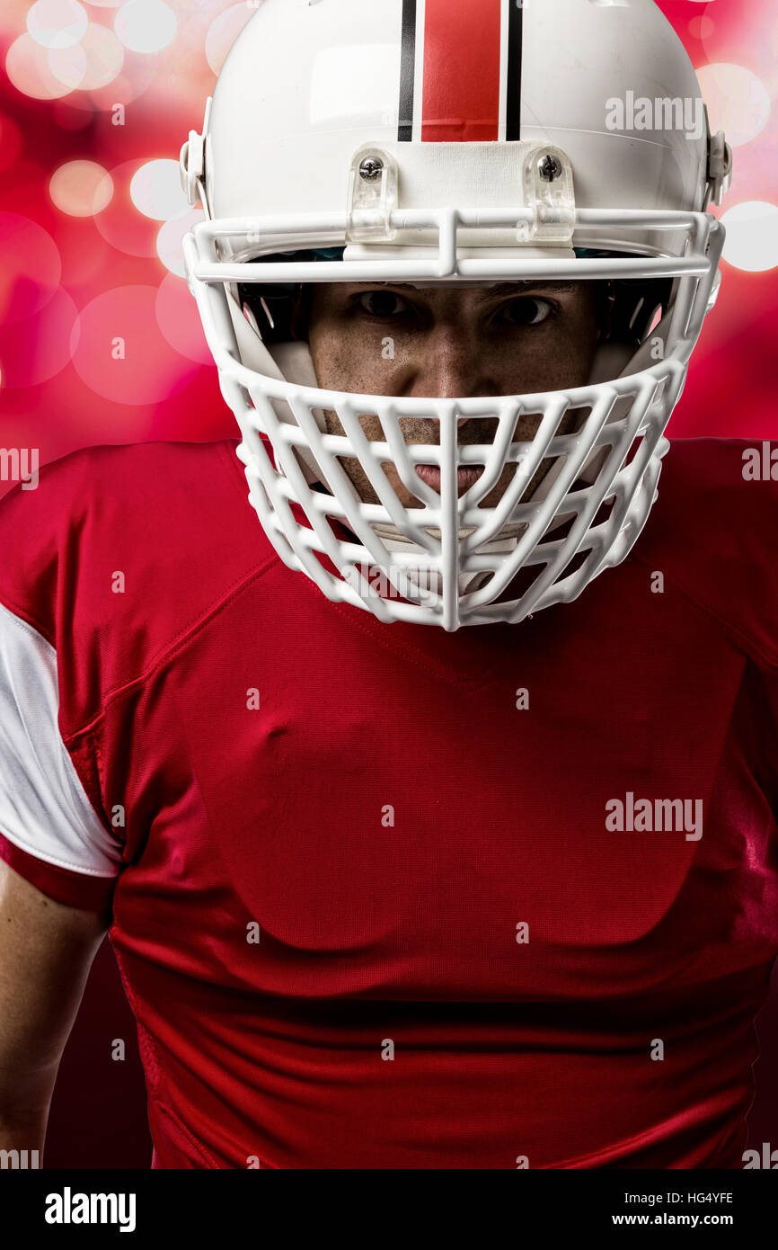 Close up of a Football Player with a red uniform on a red lights ...