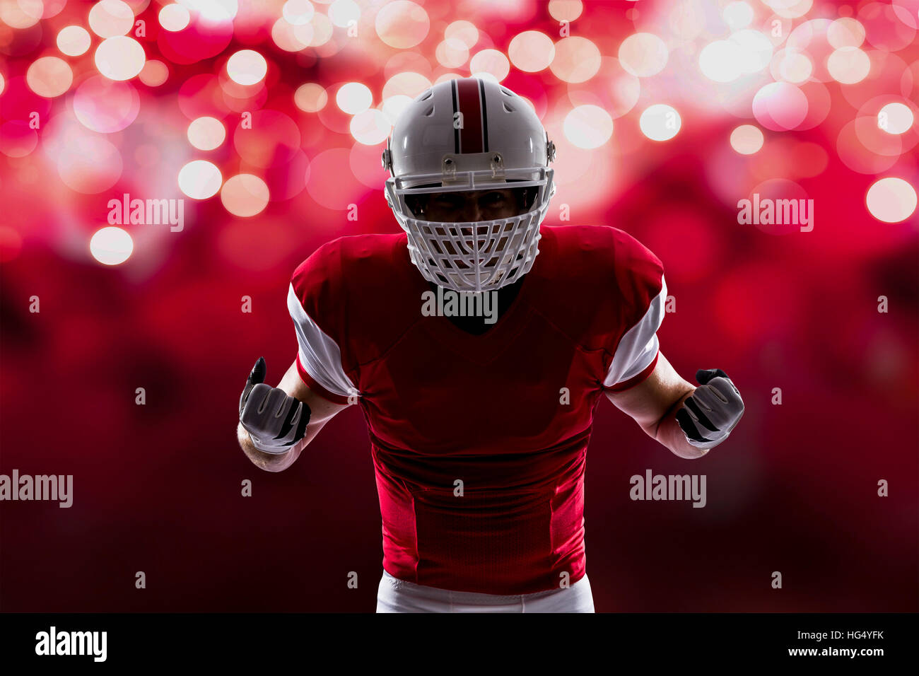 Football Player with a red uniform on a red lights background Stock ...