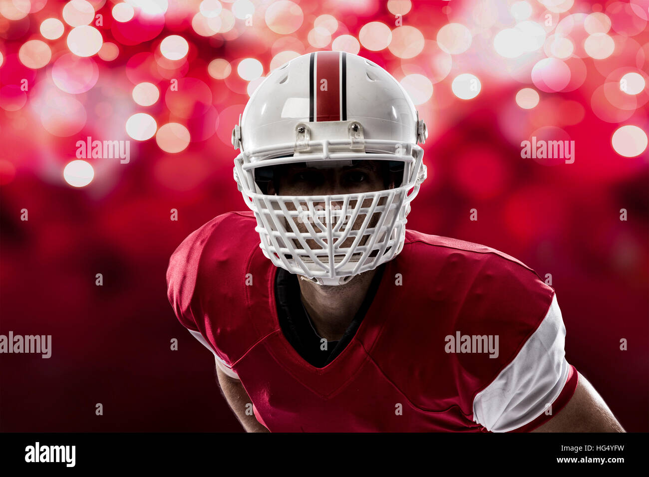 Close up of a Football Player with a red uniform on a red lights ...