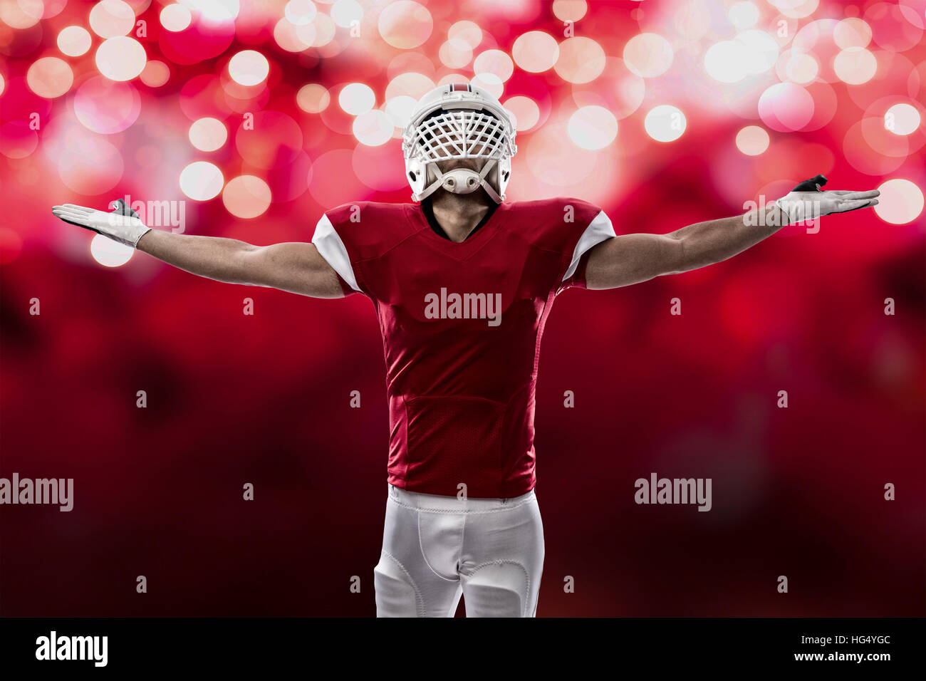 Football Player with a red uniform celebrating, on a red lights ...