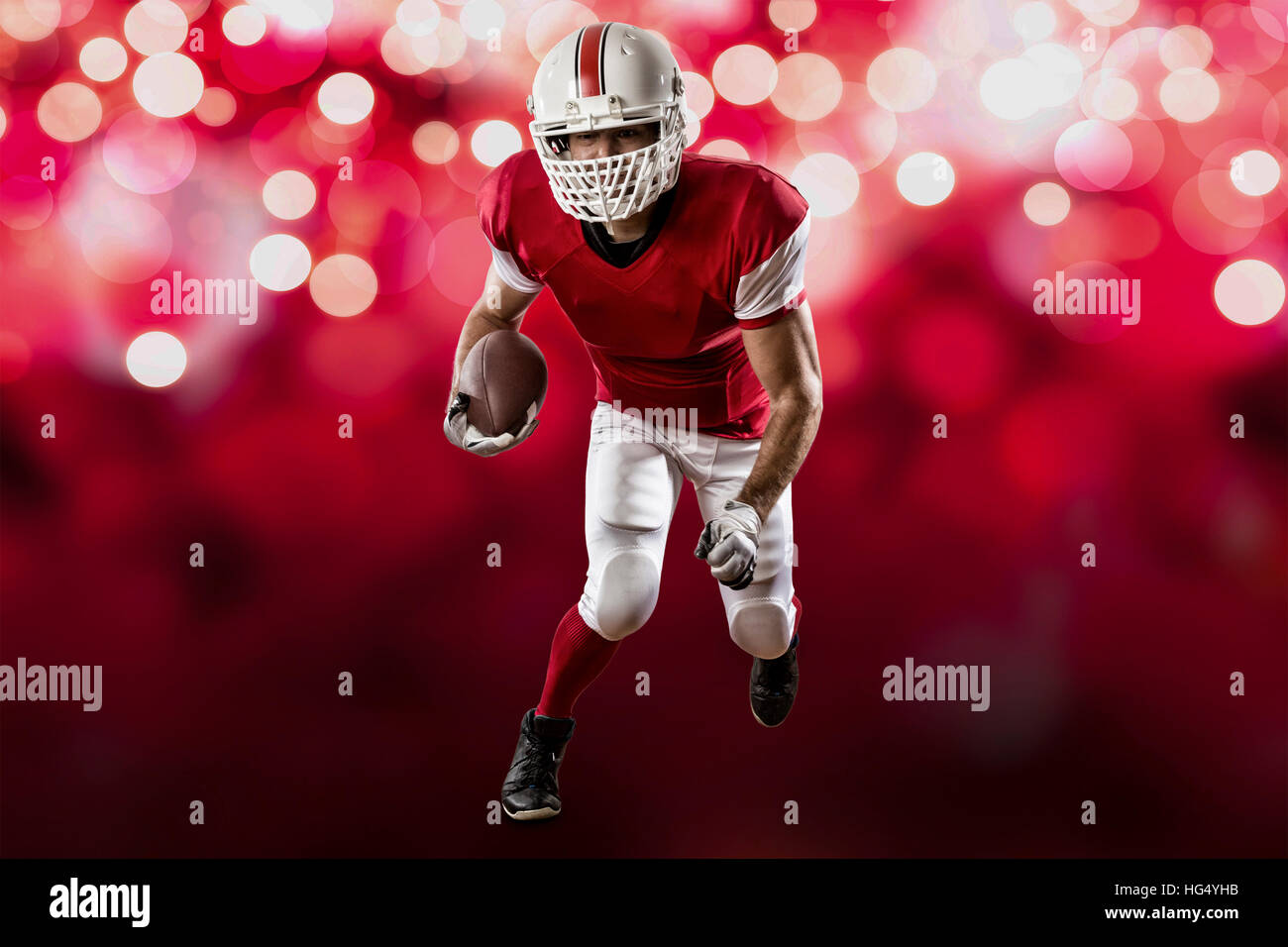 Football Player with a red uniform Running on a red lights background ...