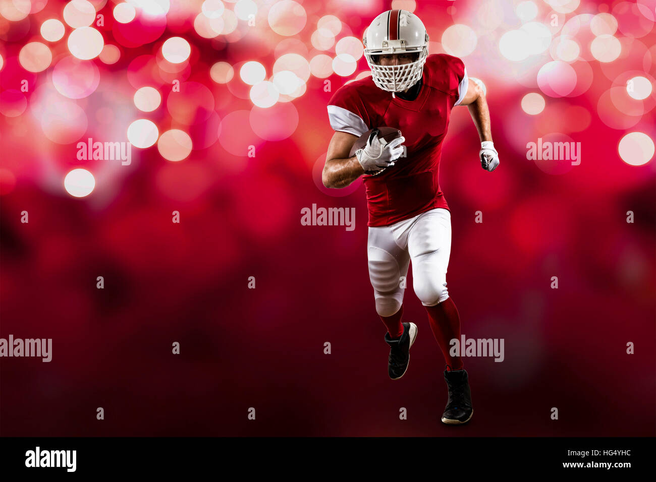 Football Player with a red uniform Running on a red lights background ...