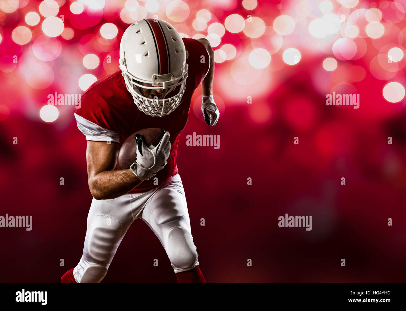 Football Player with a red uniform Running on a red lights background ...