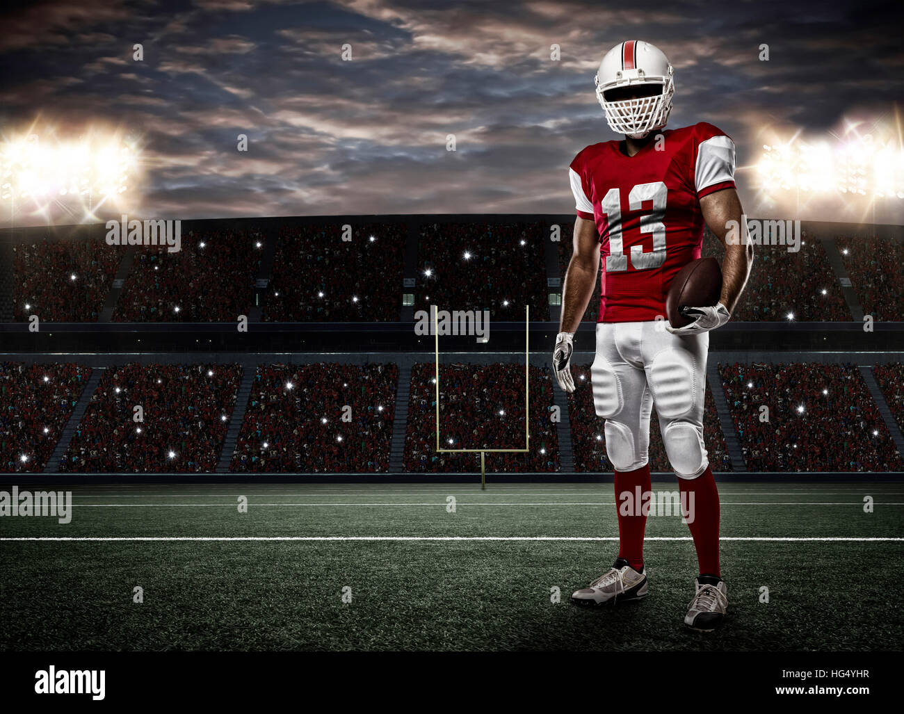 Football Player with a red uniform on a Stadium Stock Photo - Alamy