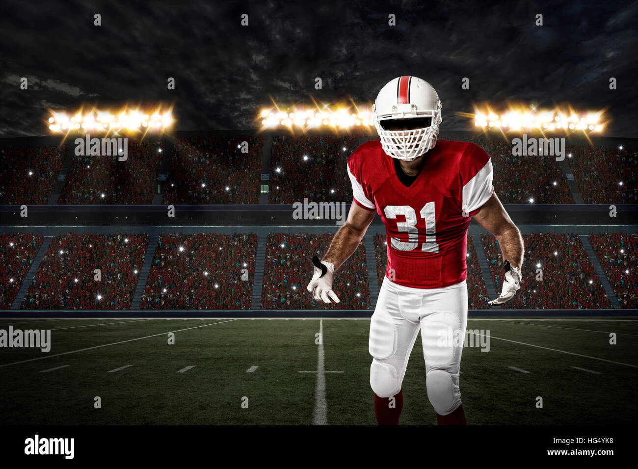 Football Player with a red uniform on a stadium Stock Photo - Alamy