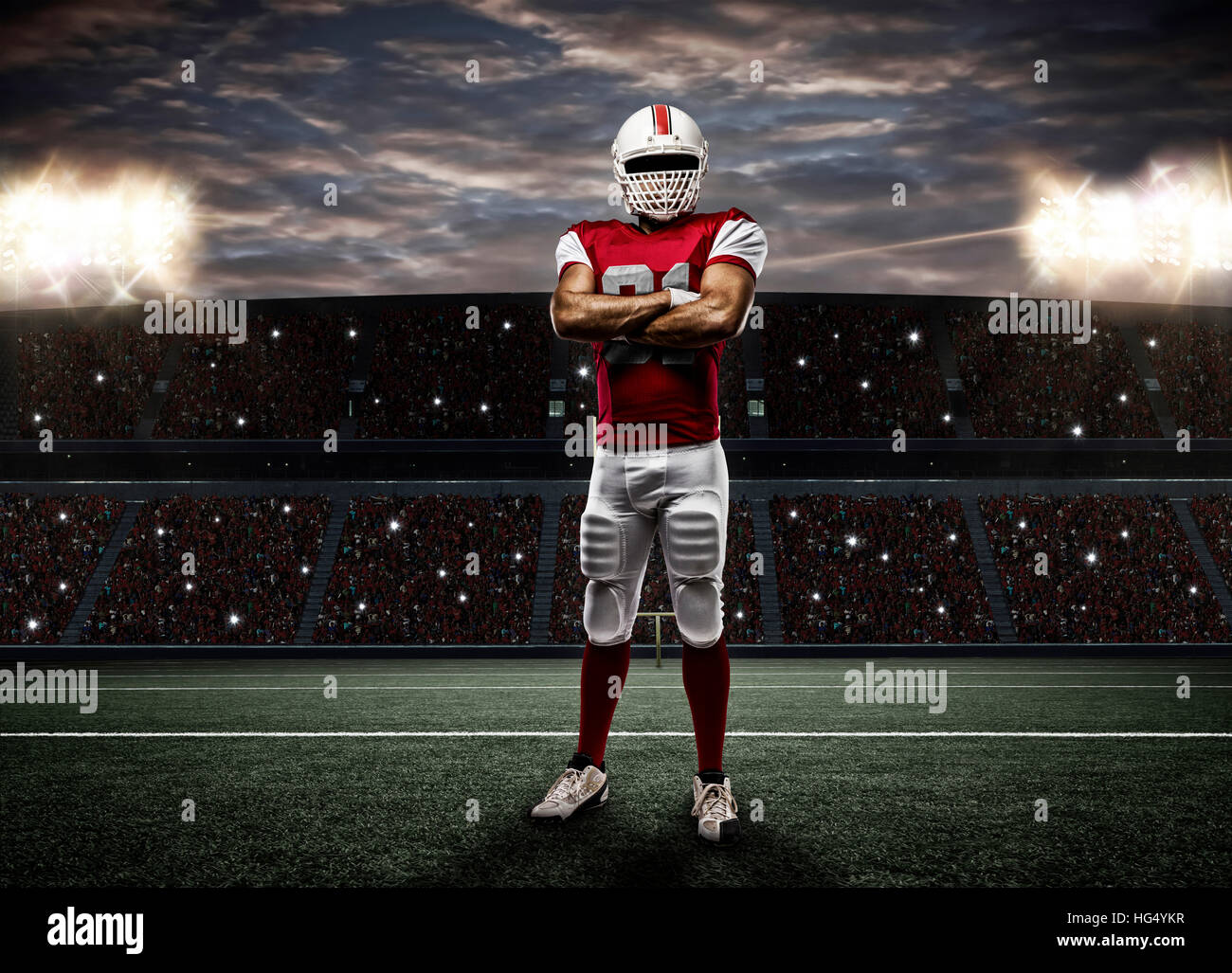 Football Player with a red uniform on a stadium Stock Photo - Alamy