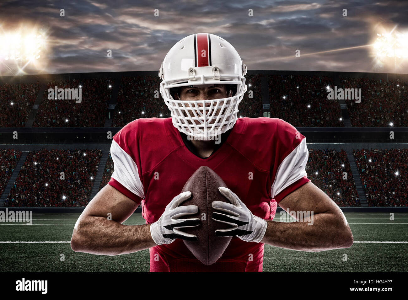 Football Player with a red uniform on a stadium Stock Photo - Alamy