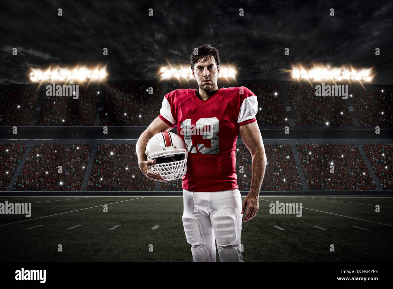 Football Player with a red uniform on a stadium Stock Photo - Alamy