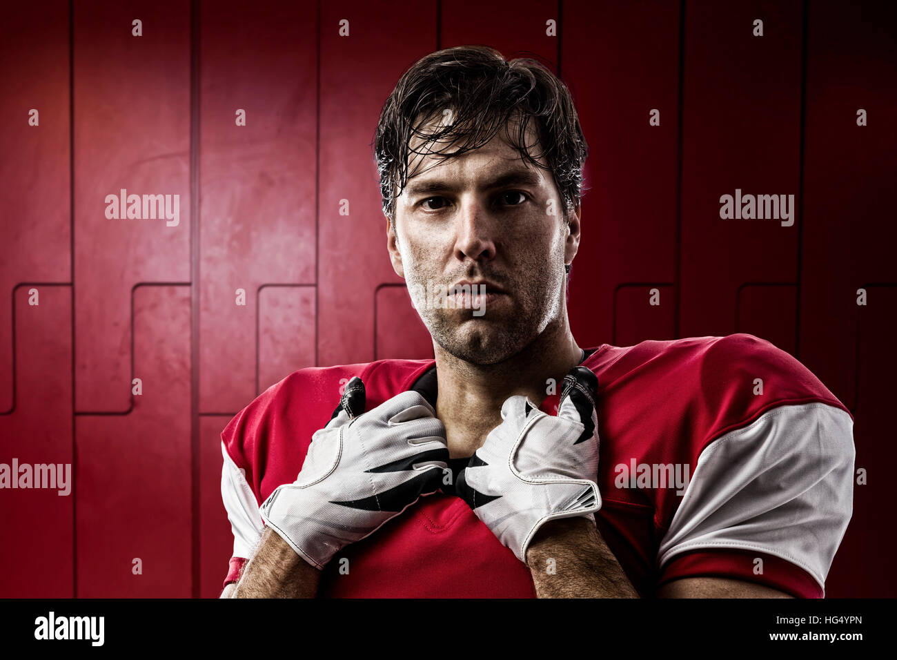 Football Player with a red uniform on a Locker roon Stock Photo - Alamy