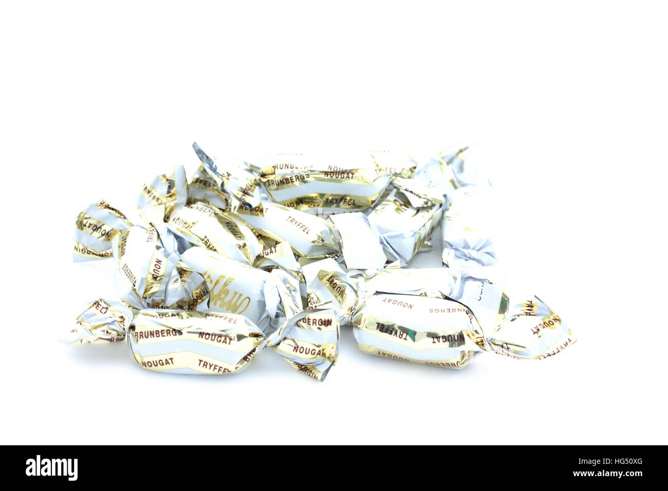 Candy in wrappers on a white background, isolated Stock Photo - Alamy