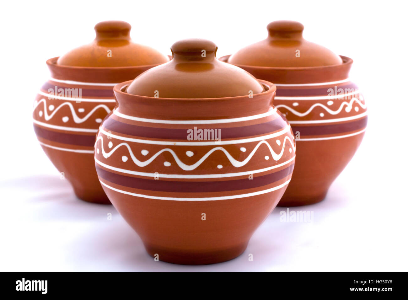 Three clay pots on a white background, isolated Stock Photo - Alamy