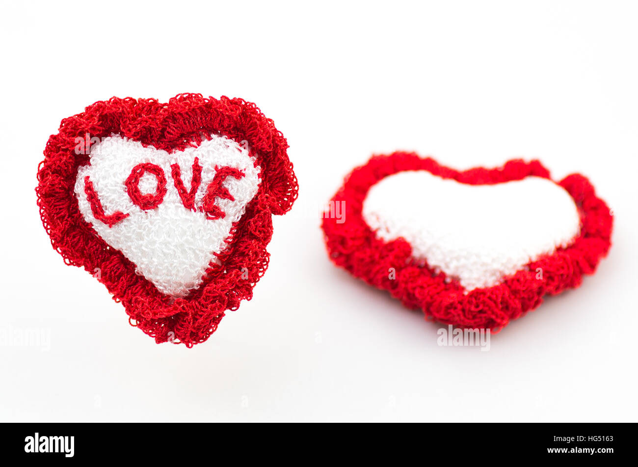 Two handmade heart knitted made from yarn and with word love Stock ...