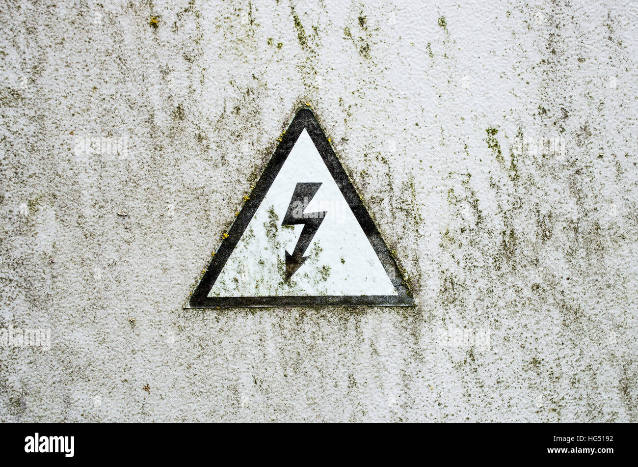 The old high voltage sign on white metal plate Stock Photo - Alamy