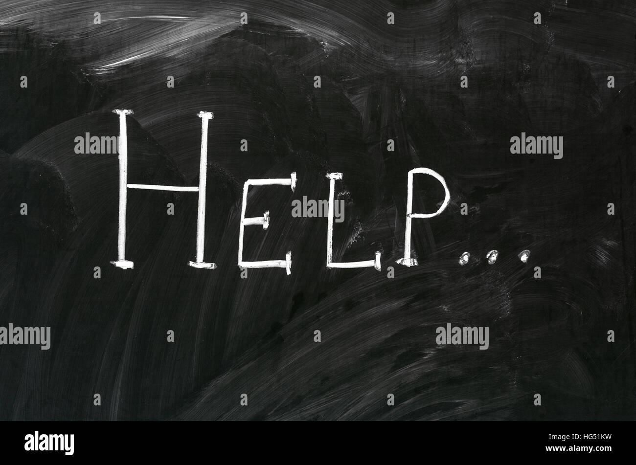 Help word handwritten with white chalk on a blackboard Stock Photo - Alamy