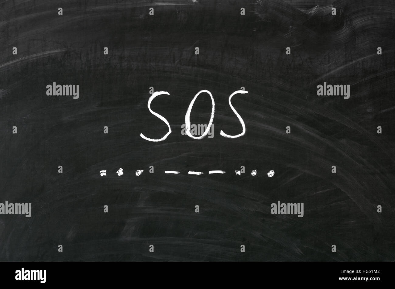 SOS word handwritten with white chalk on a blackboard Stock Photo - Alamy
