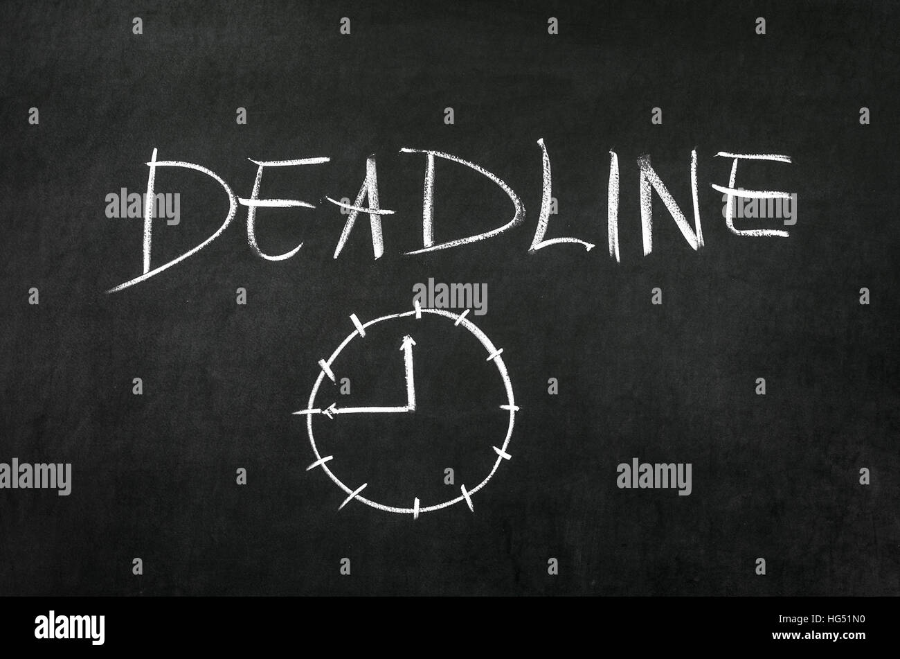 Deadline and clock drawed on blackboard with chalk Stock Photo - Alamy