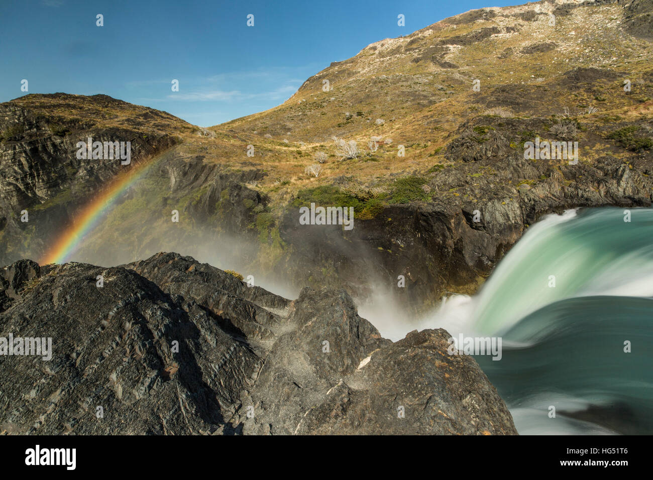 A rainbow in the mist of the Salto Grande Waterfall on the Rio Paine ...