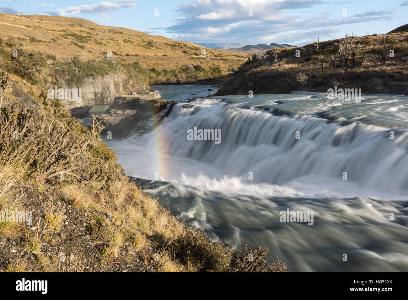 A rainbow in the mist at the Rio Paine Waterfalls, Torres del Paine ...