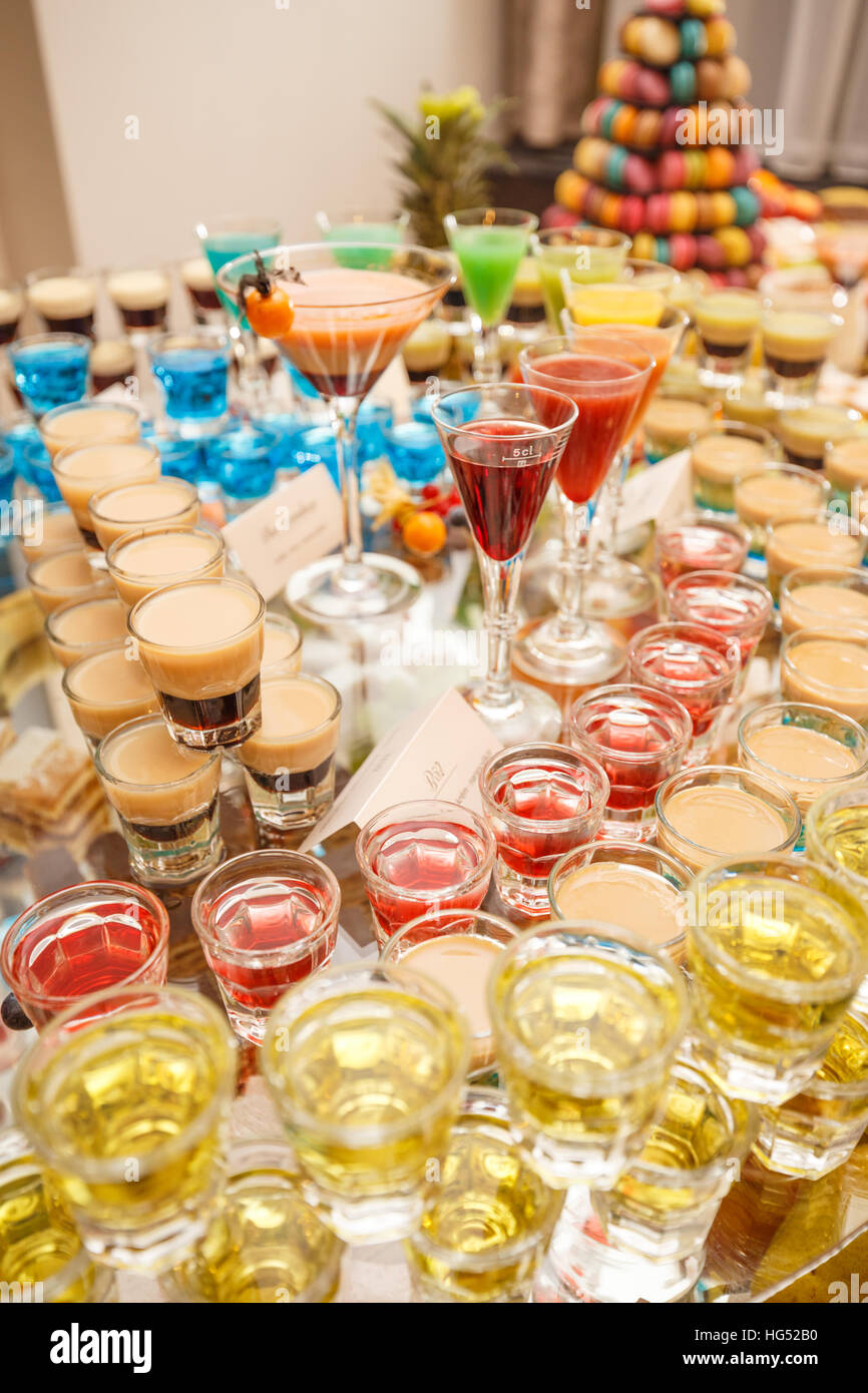 Variation of hard alcoholic shots served on bar counter Stock Photo - Alamy