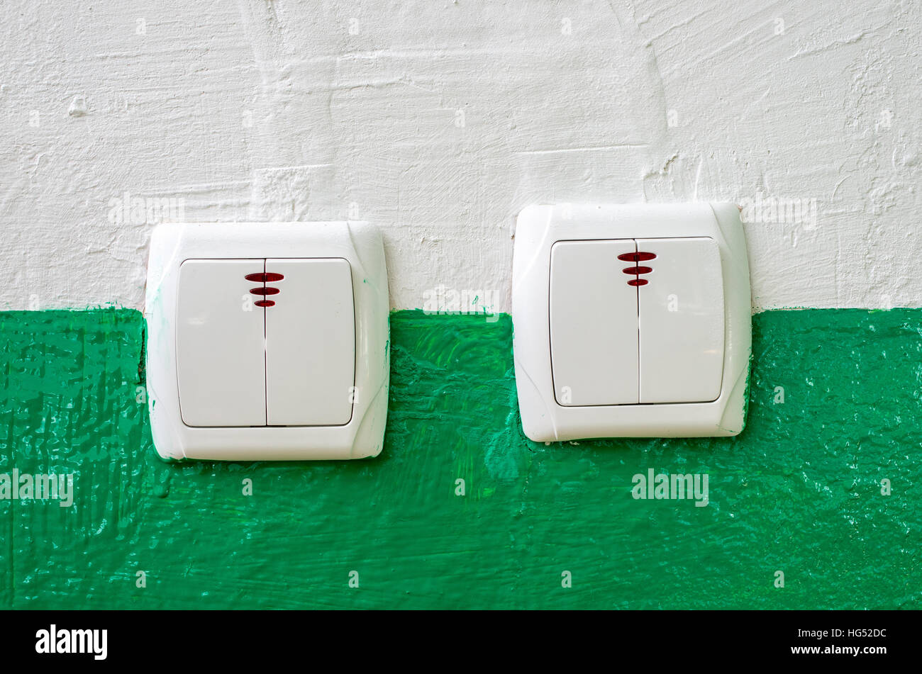 New electrical switches in the wall. Construction defect Stock Photo ...