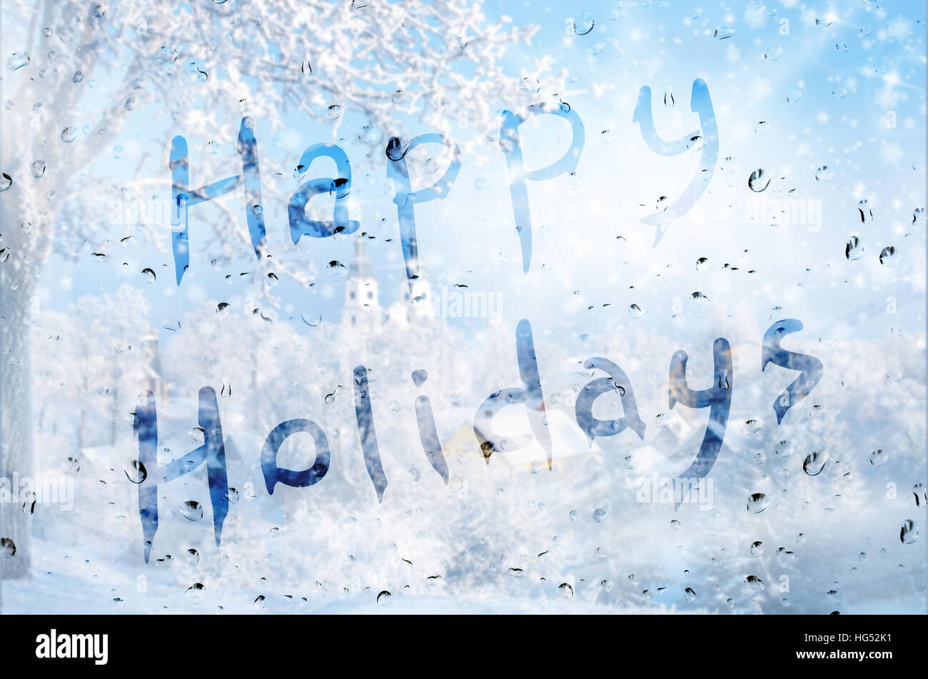 Rain on glass with Happy holidays text Stock Photo - Alamy