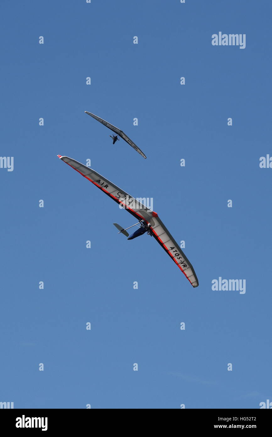 Two rigid wing hang gliders against blue sky Stock Photo - Alamy