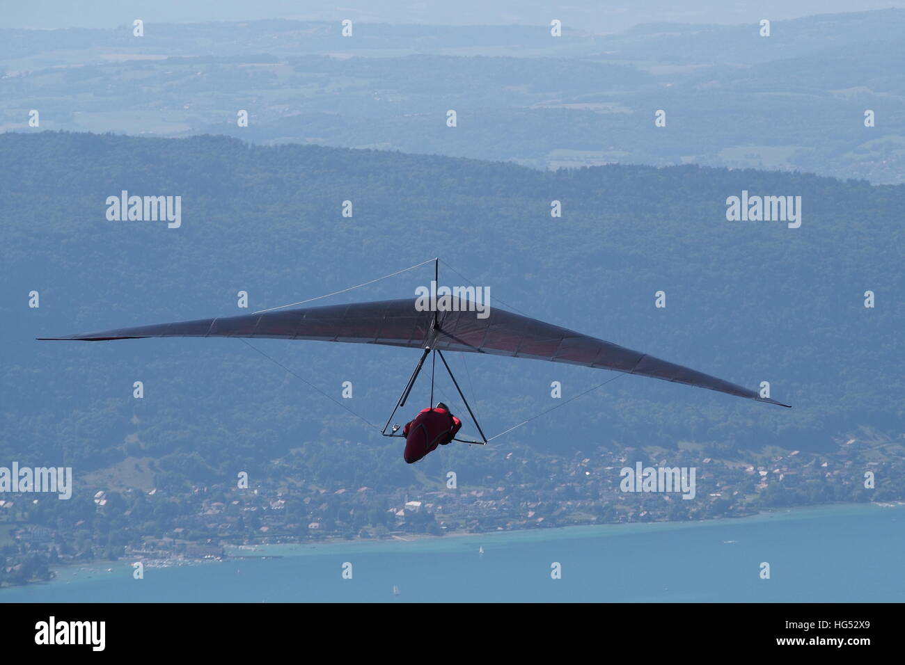 Hang glider flying above Lake Annecy France Stock Photo - Alamy