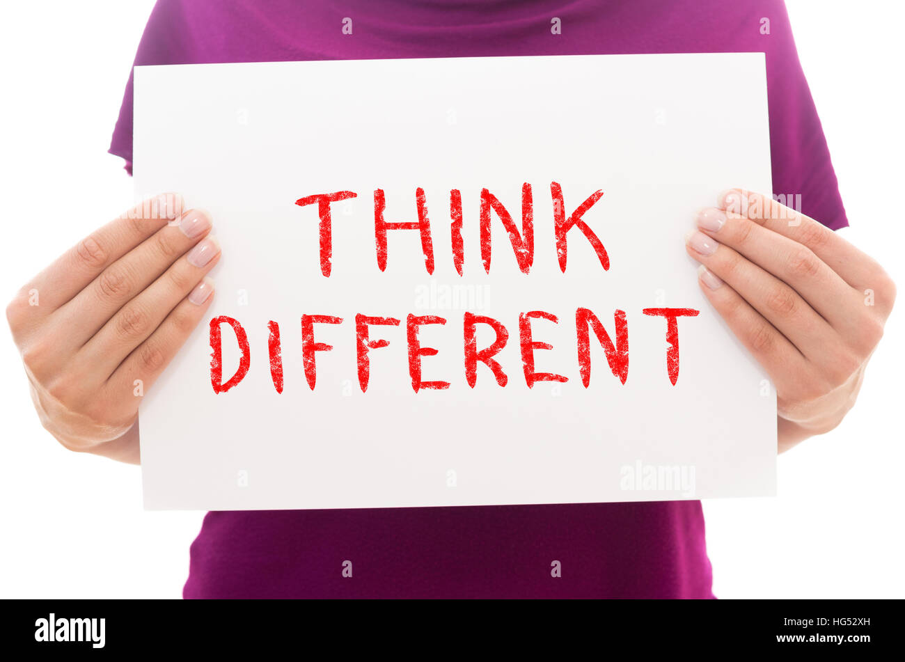 Girl holding white paper sheet with text Think different Stock Photo ...