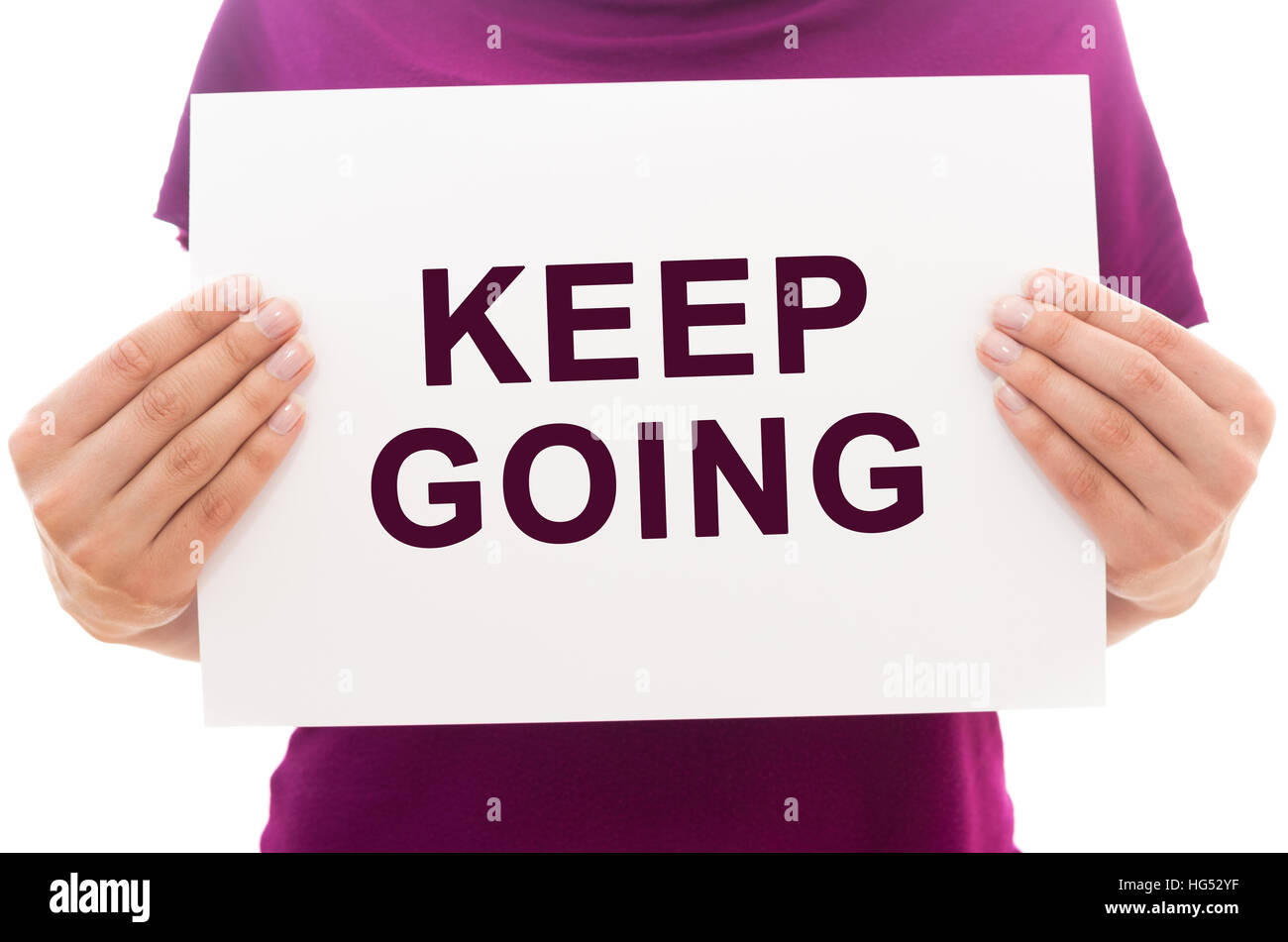 Girl holding white paper sheet with text Keep going Stock Photo - Alamy