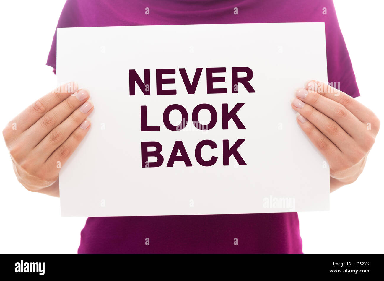 Girl holding white paper sheet with text Never look back Stock Photo ...