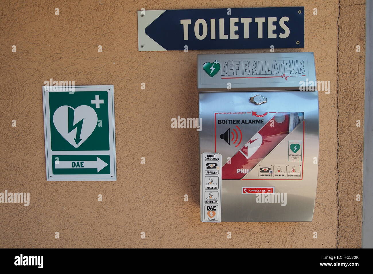 Defibrillator on wall of French building Stock Photo - Alamy