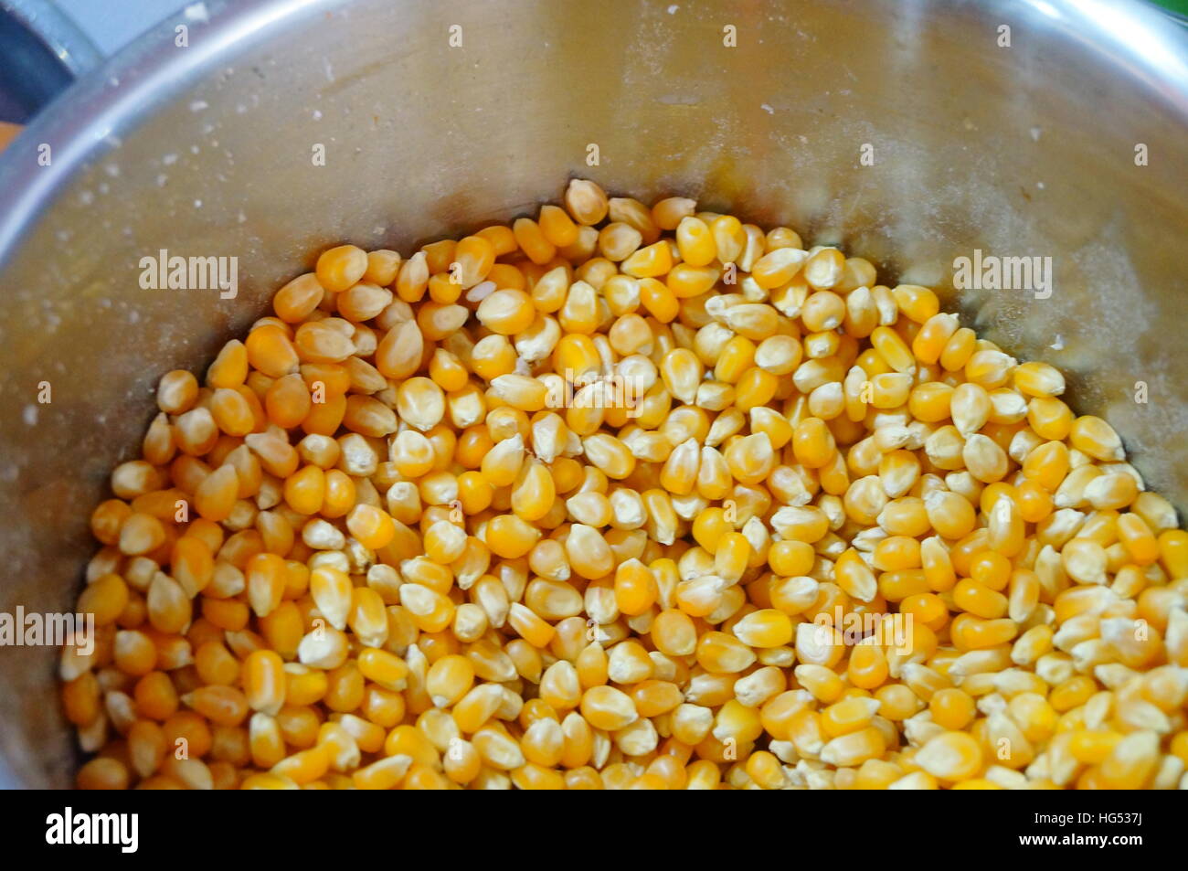 A stack of corn kernels as a raw material for popcorn Stock Photo - Alamy