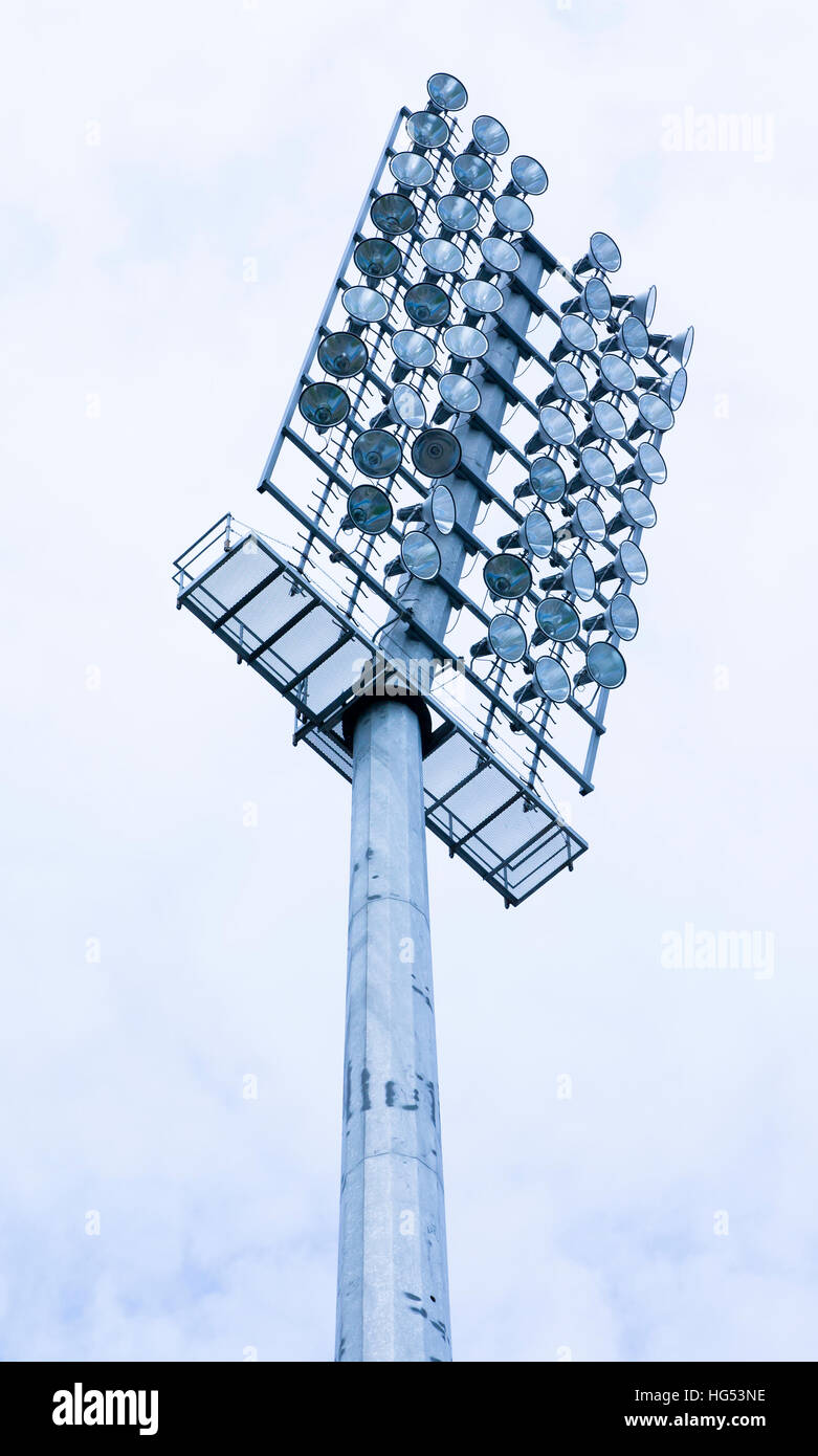 Stadium projector on blue sky background at summer Stock Photo - Alamy