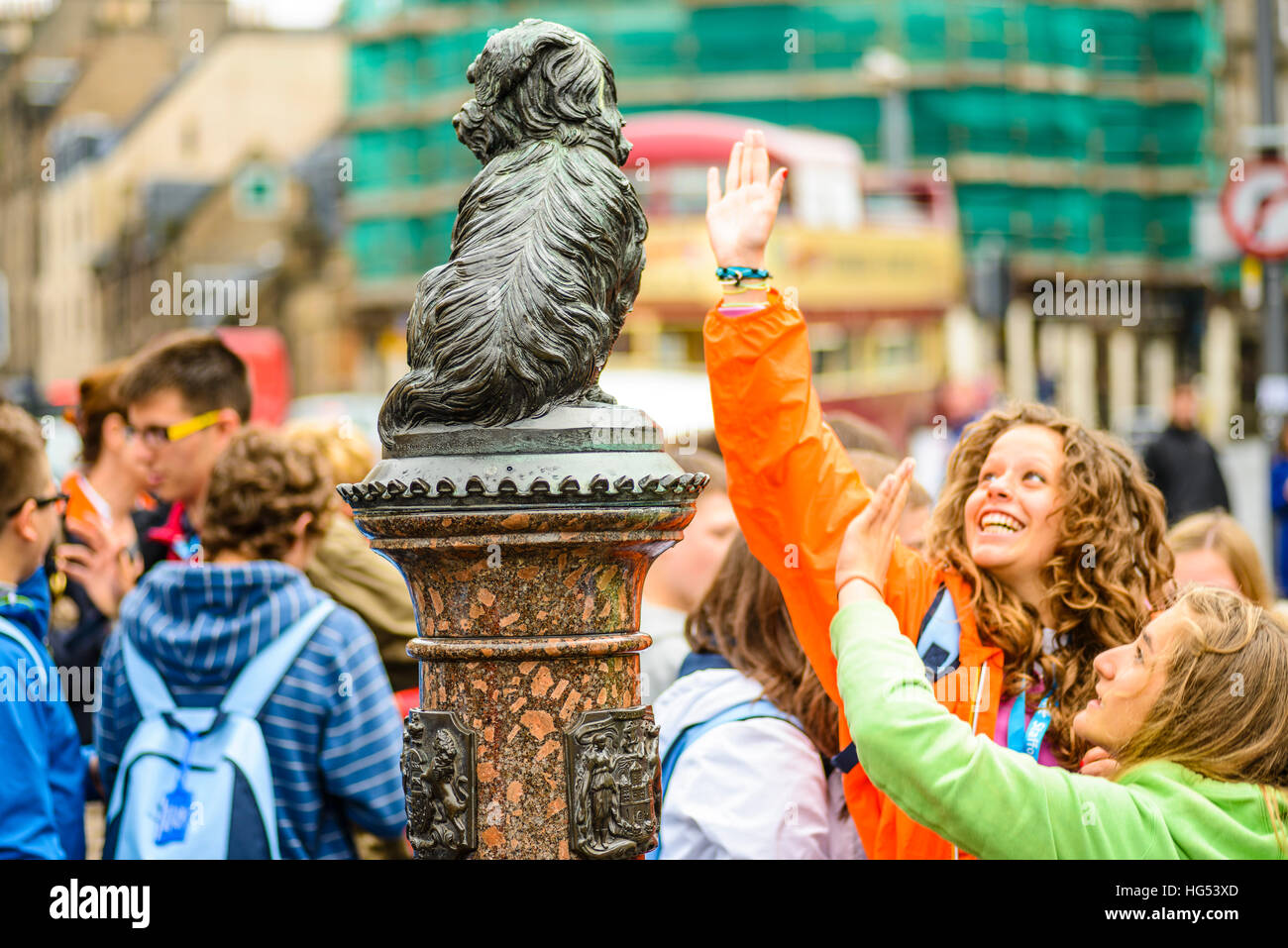 Girls jump to touch the statue of Greyfriars Bobby in Edinburgh ...