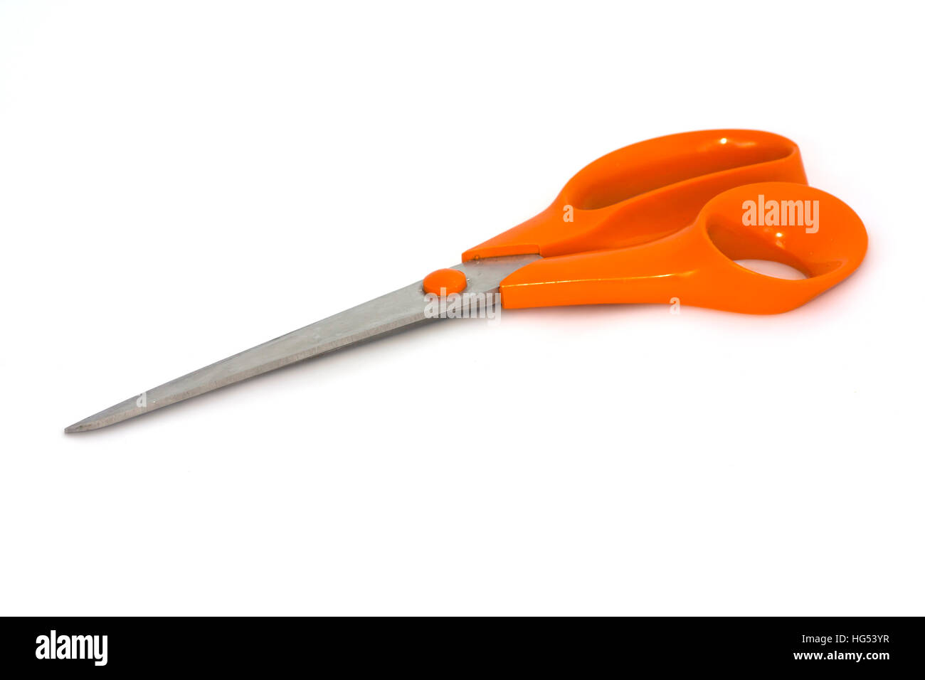 Scissors with orange handles on a white background Stock Photo - Alamy