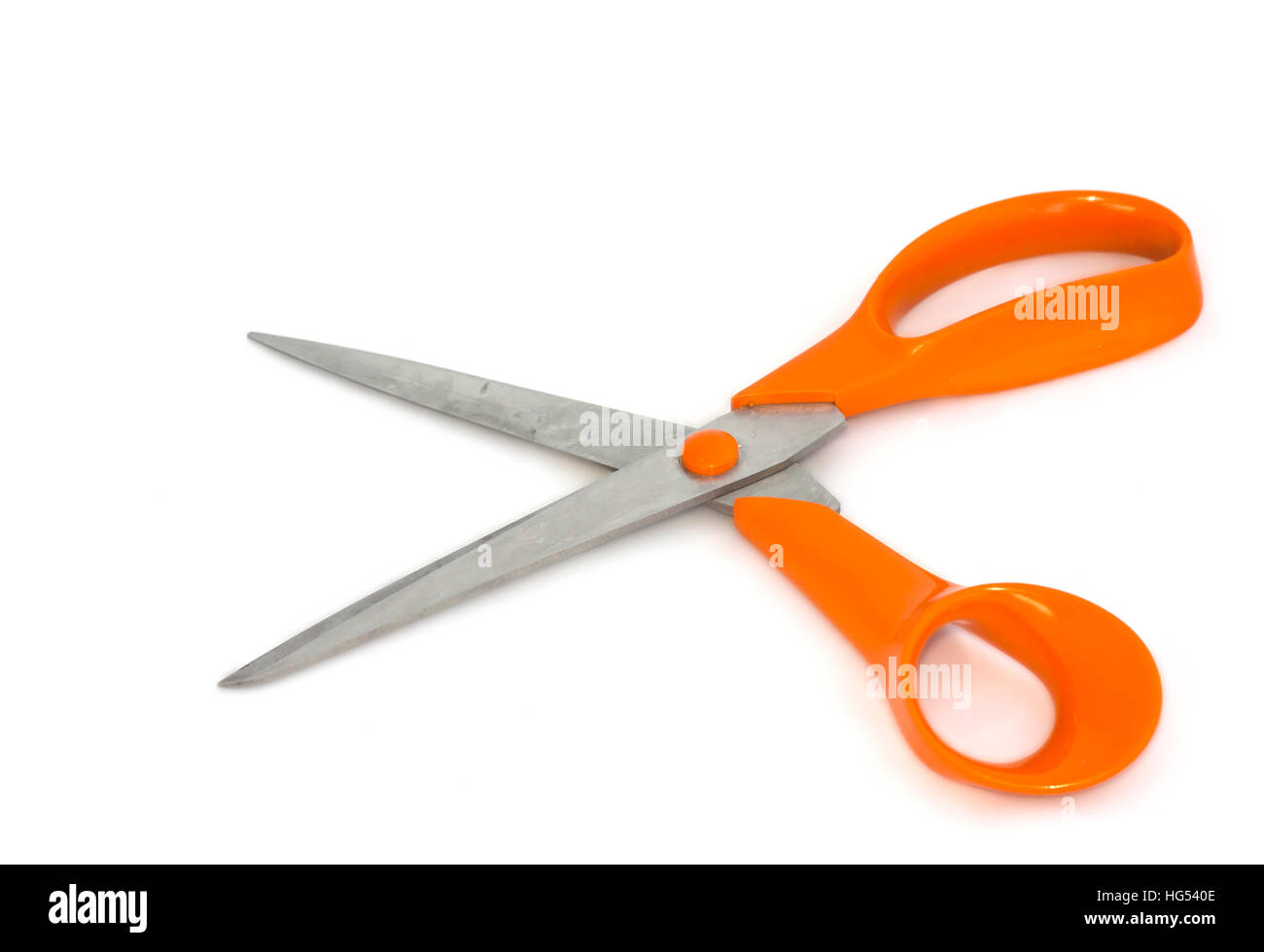 Scissors with orange handles on a white background Stock Photo - Alamy