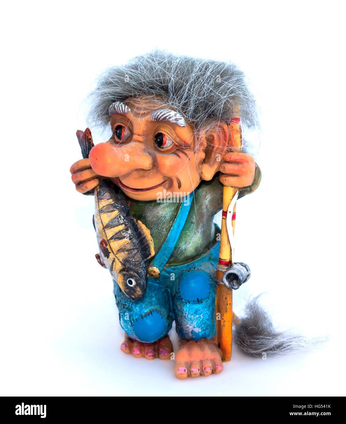 Fisher troll with fishing rod and fish figurine on a white background ...