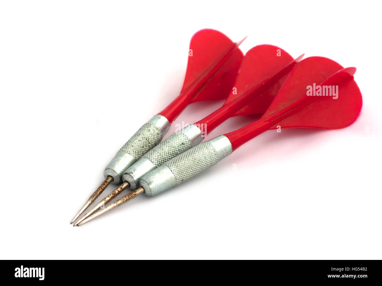 Three darts on a white background, isolated Stock Photo - Alamy