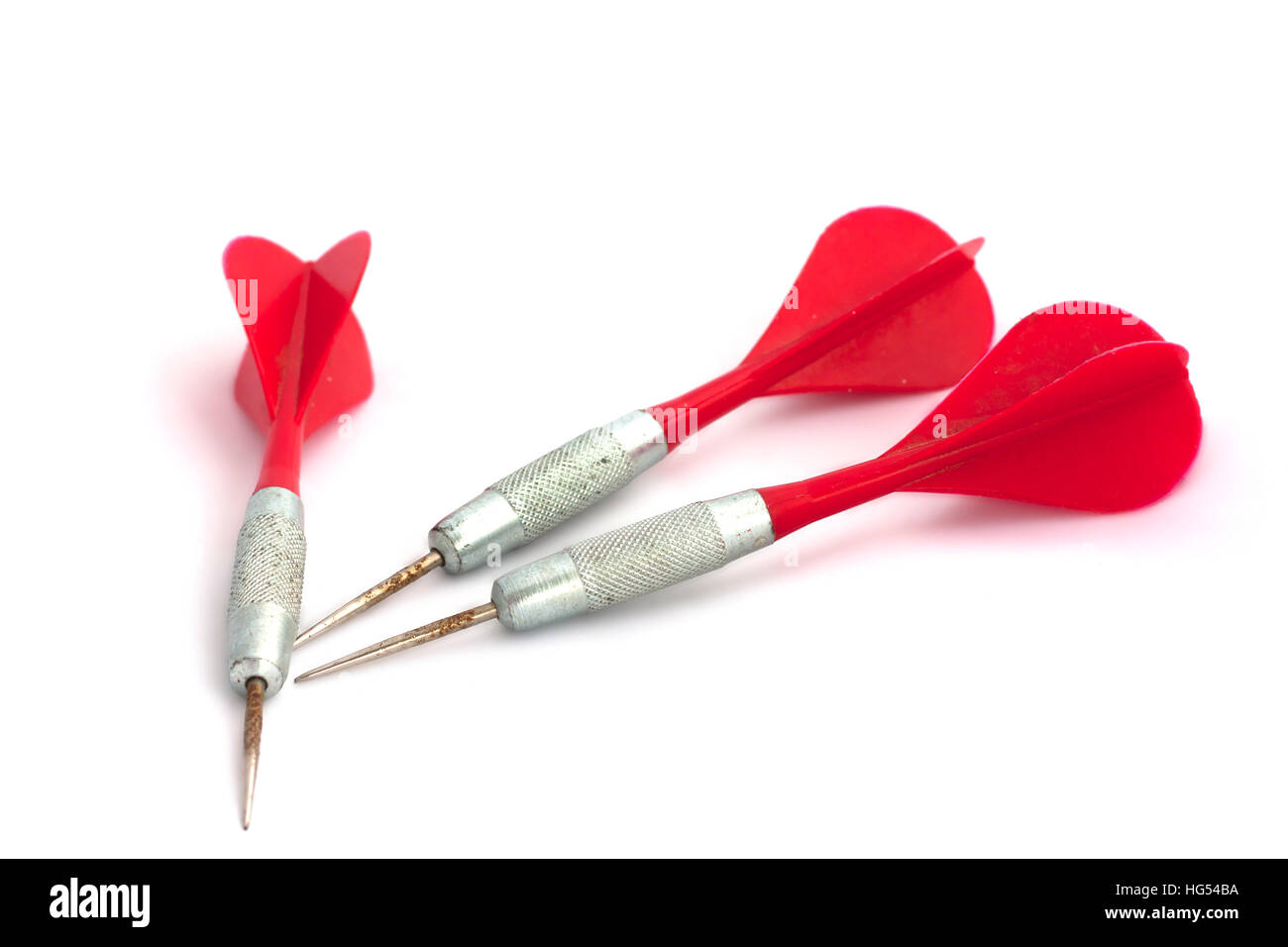 Three darts on a white background, isolated Stock Photo - Alamy