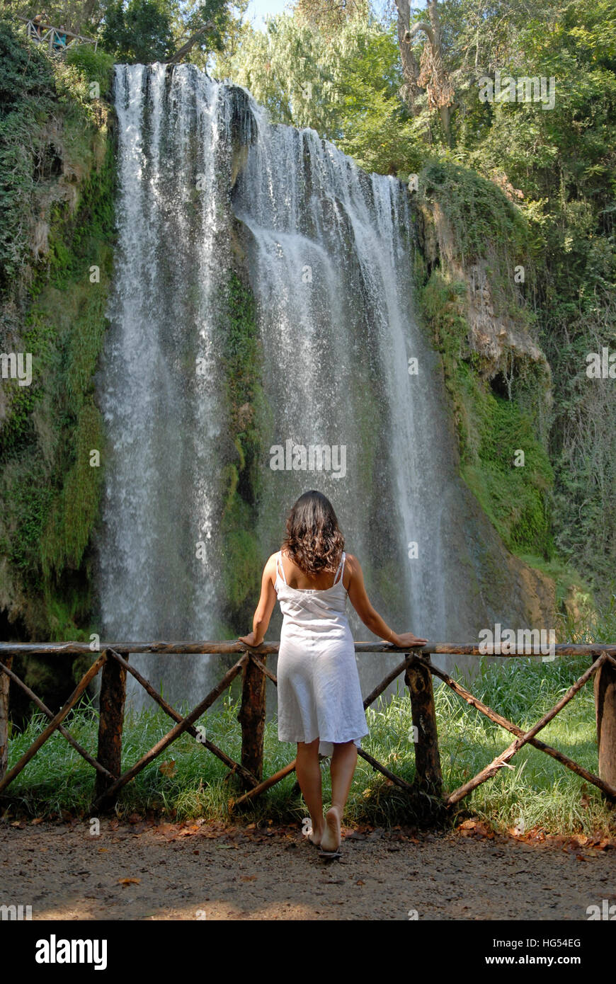 Young cute woman and waterfall Stock Photo - Alamy