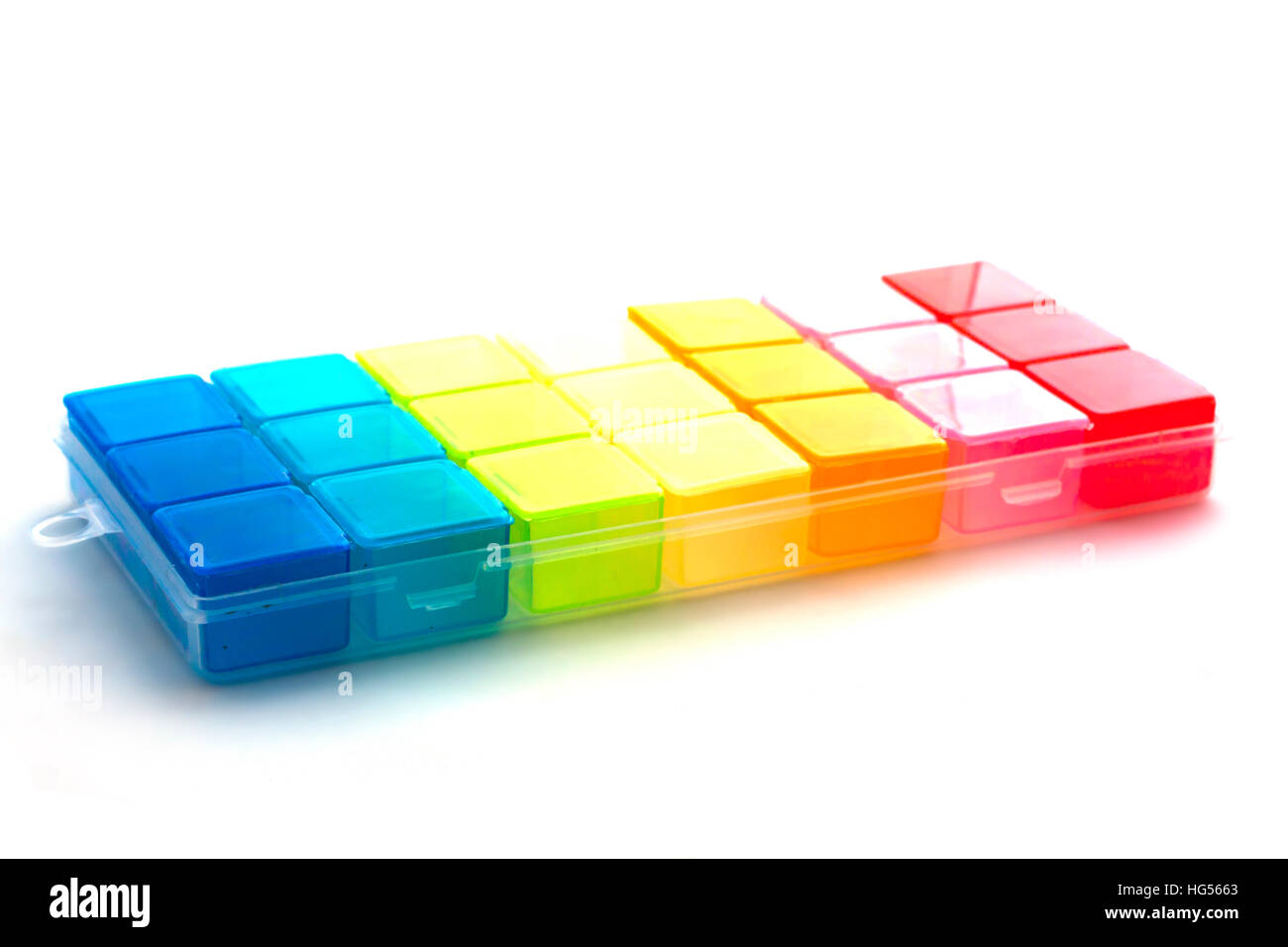 Colored pillbox on a white background, isolated Stock Photo - Alamy