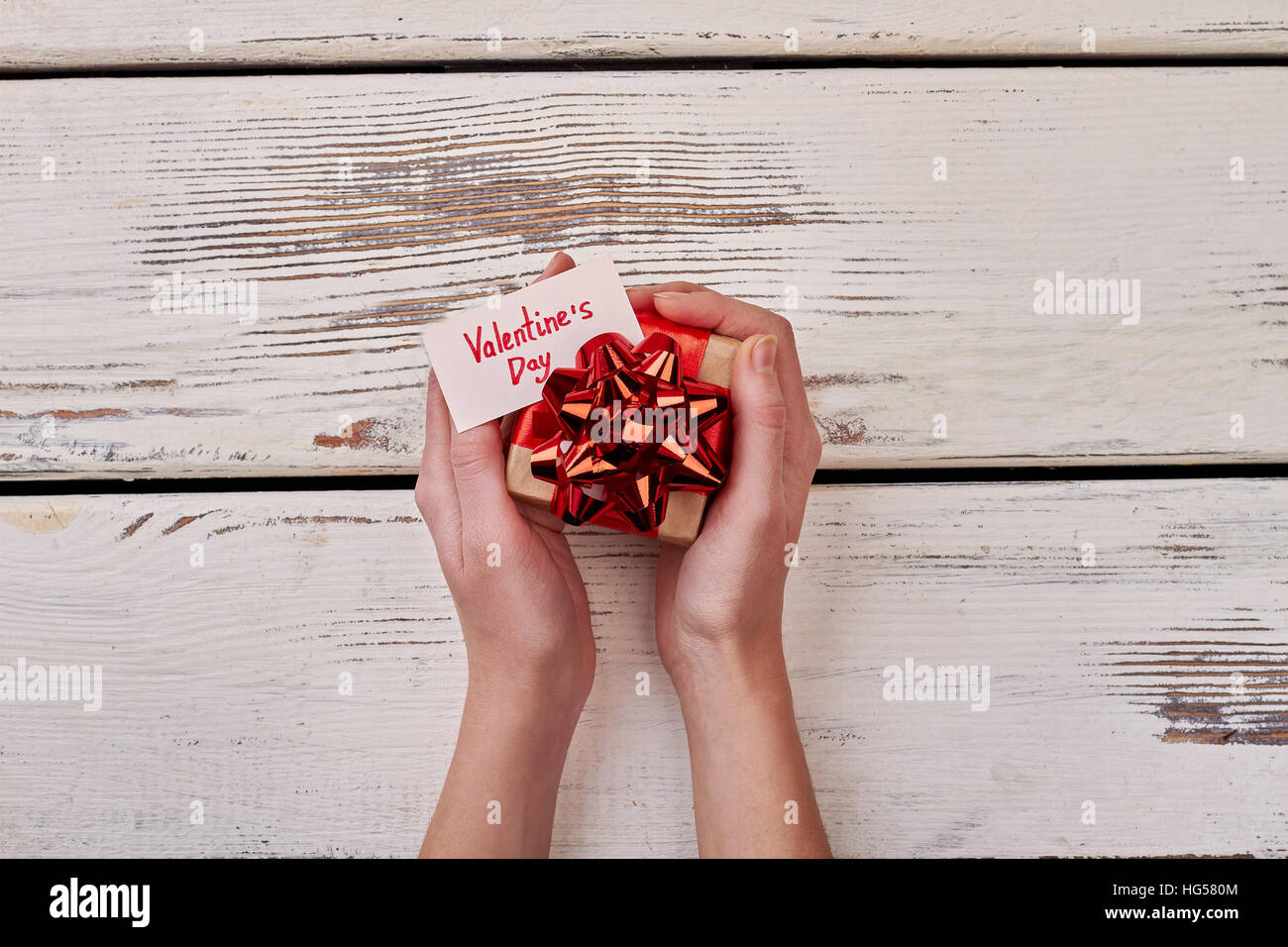 Small present box in hands Stock Photo - Alamy