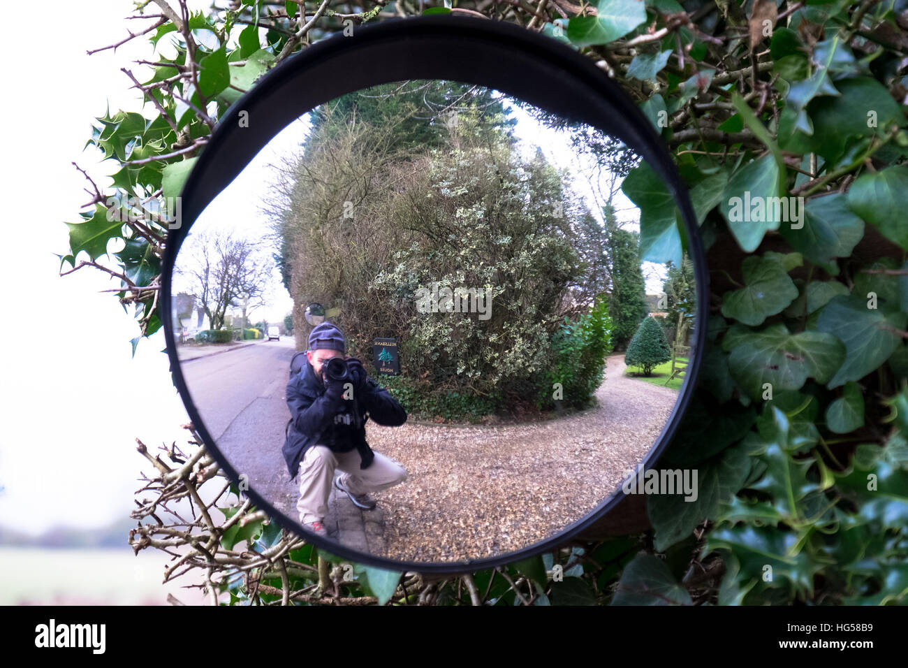 Photography shoots his own reflection in a mirror Stock Photo - Alamy