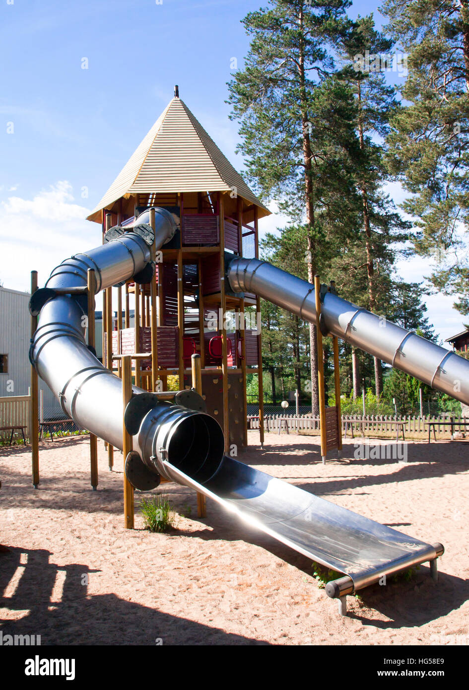 A children's playground with a slide Stock Photo - Alamy