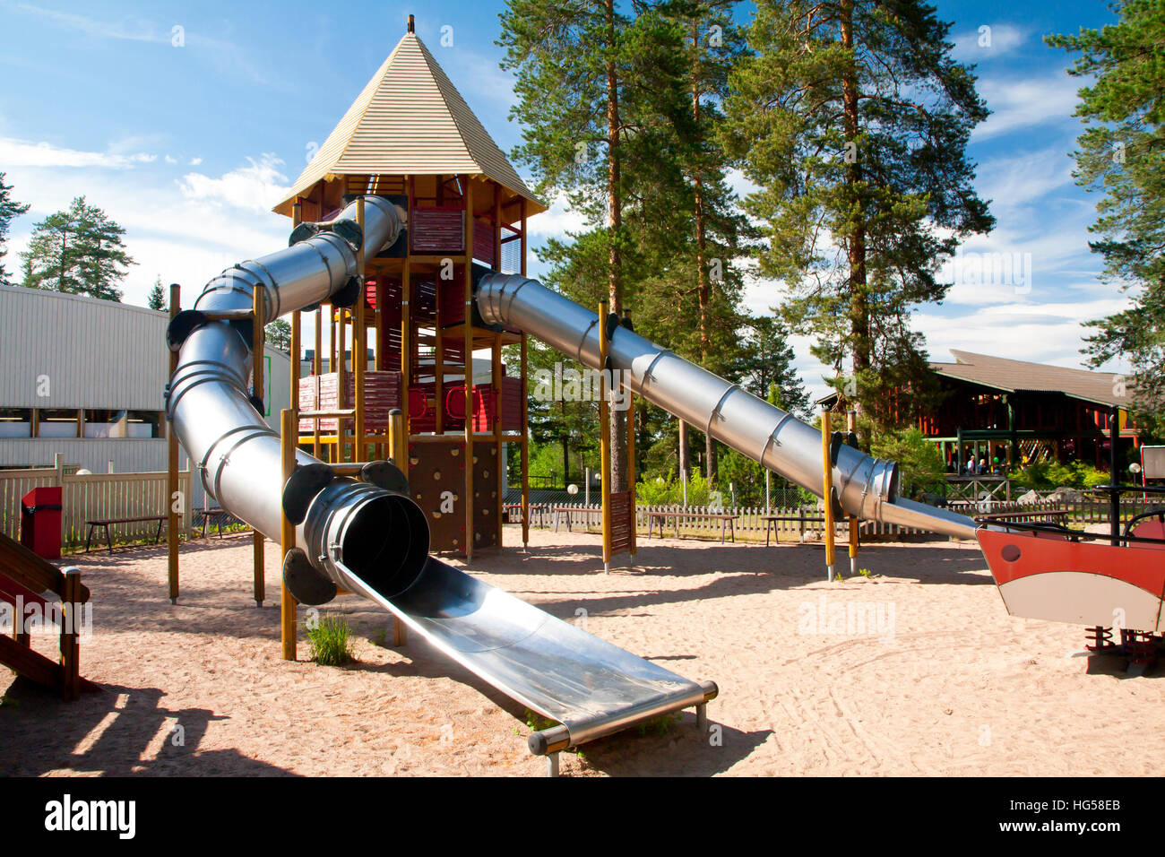 A children's playground with a slide Stock Photo - Alamy