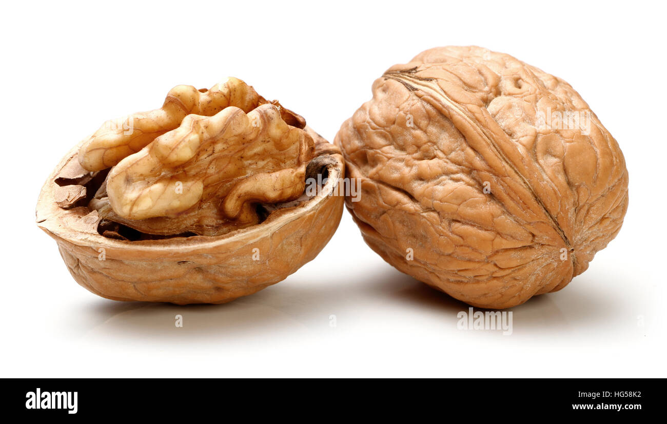 Whole walnut and half walnut piece Stock Photo - Alamy