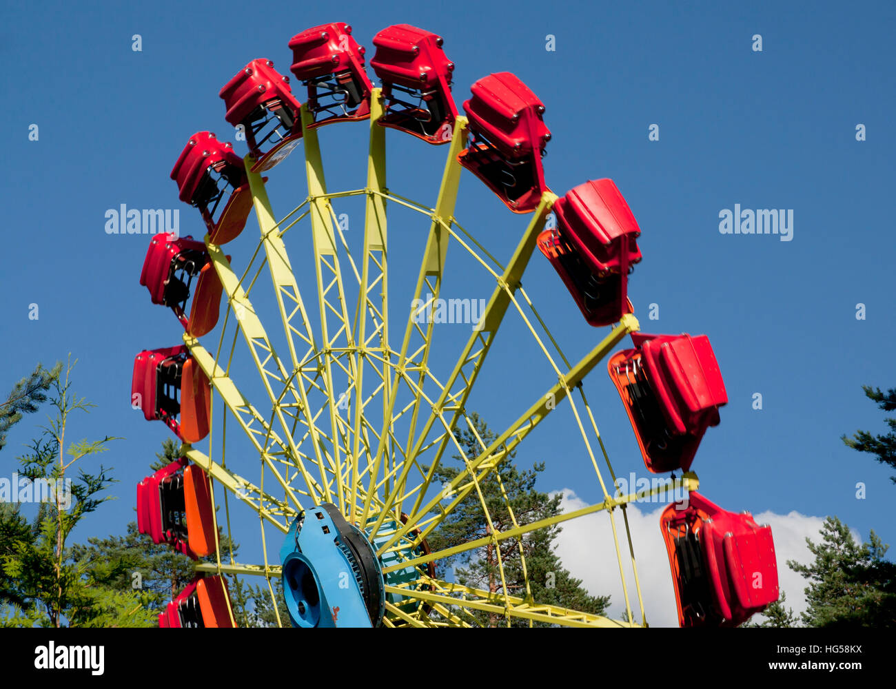 Carousel in an amusement park on sky background Stock Photo - Alamy